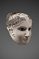 Mask of a woman with her hair rolled back at the forehead and temples ...